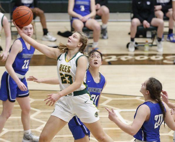Medina's Shannon Wojciak lays the ball in for two past Brunswick ...