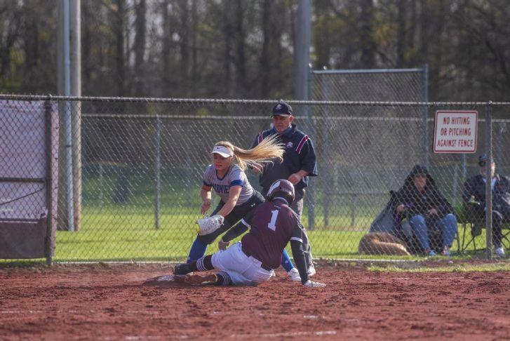 From Left: Midview's Lily Tomasheski (29) fails to tag out Wellington's ...