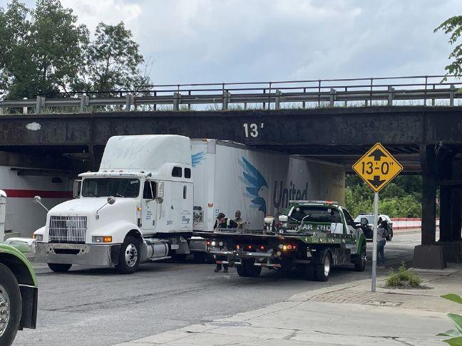 Semitruck wedges under Washington Ave. railroad bridge (Updated ...
