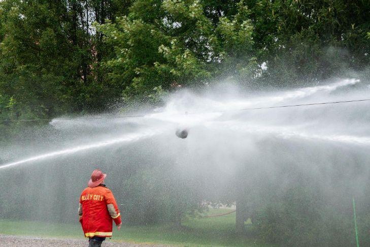Local fire departments compete in water barrel fight | Medina Gazette